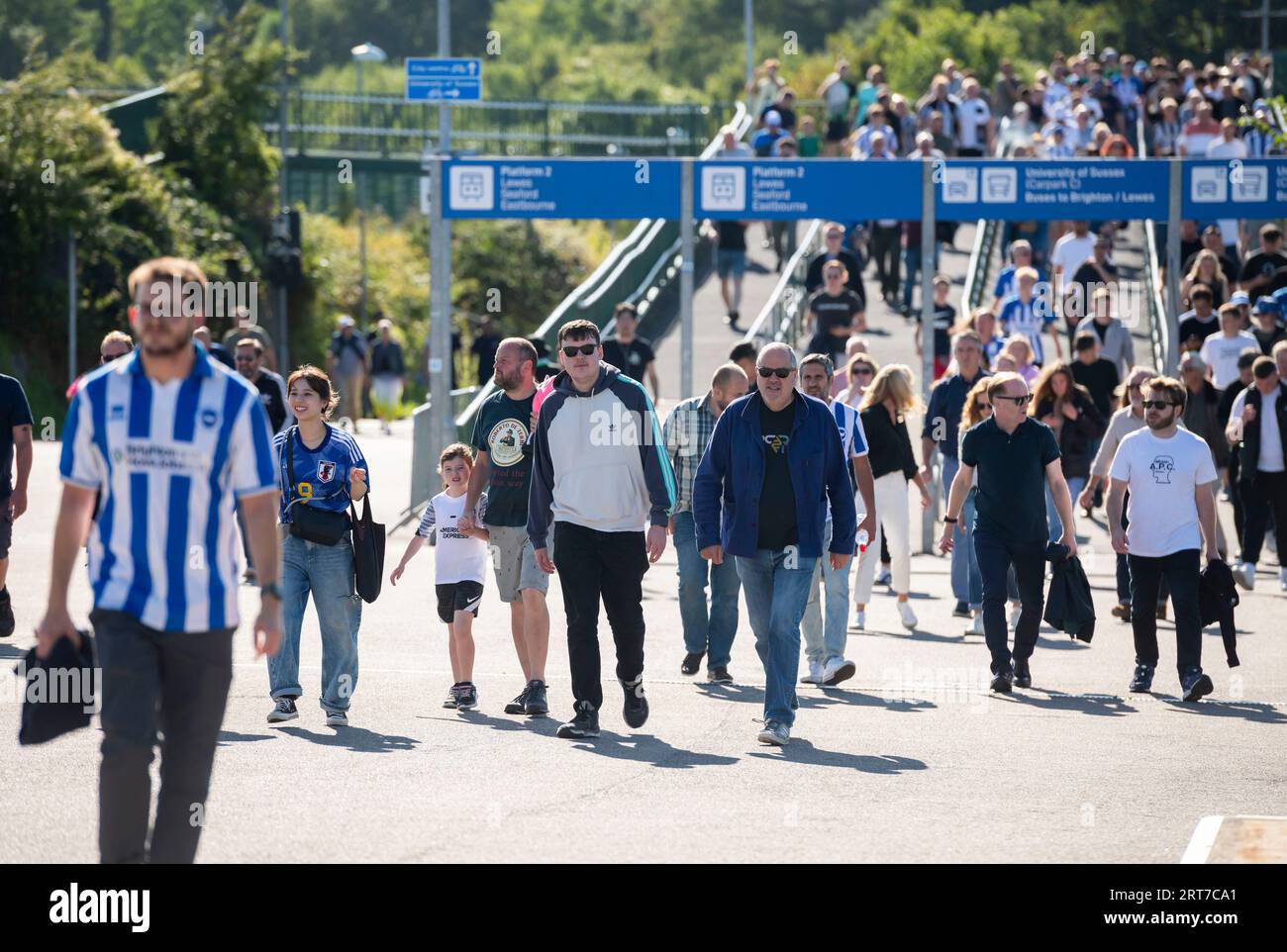 Football fans arriving off the train to Brighton and Hove Albion ...