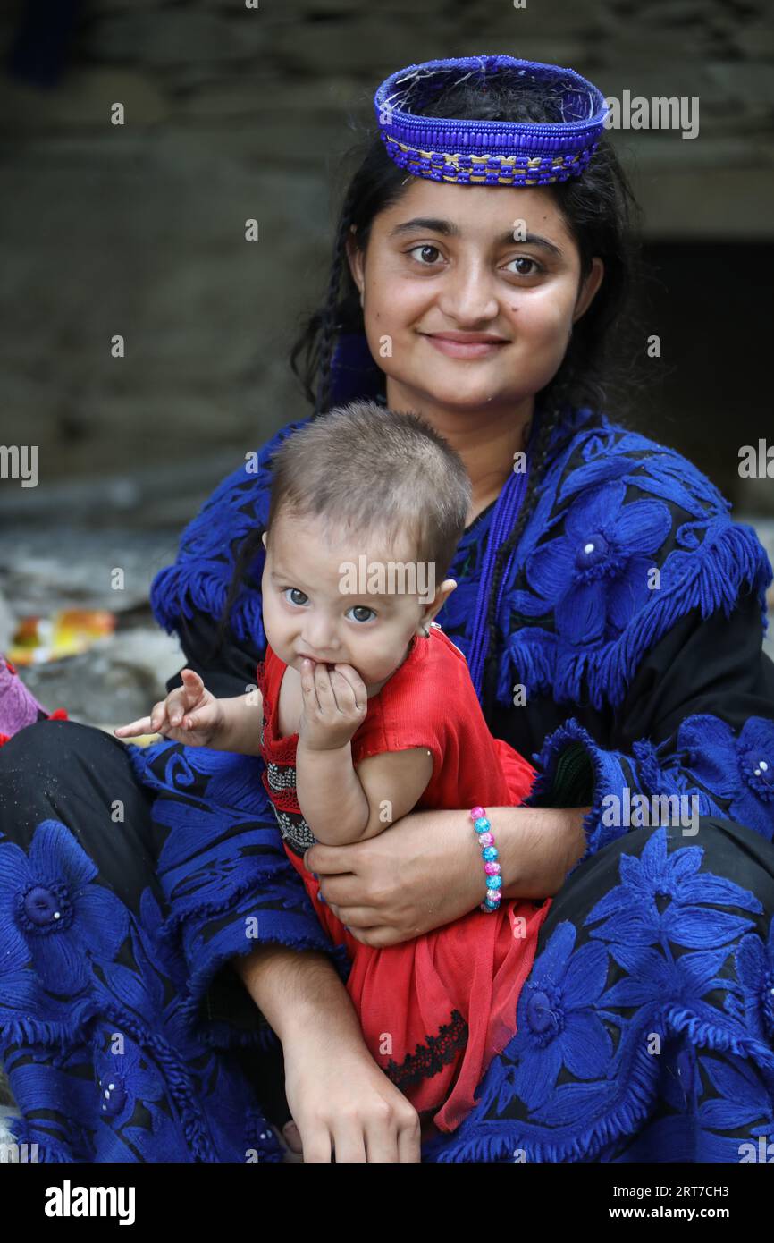 Mother and child in a Kalasha village Stock Photo - Alamy