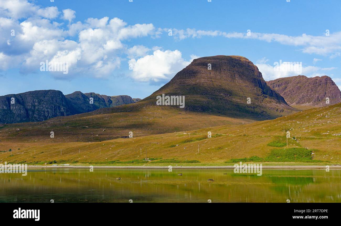 Applecross Scotland Bealach na Ba mountains reflected in the Loch a red ...