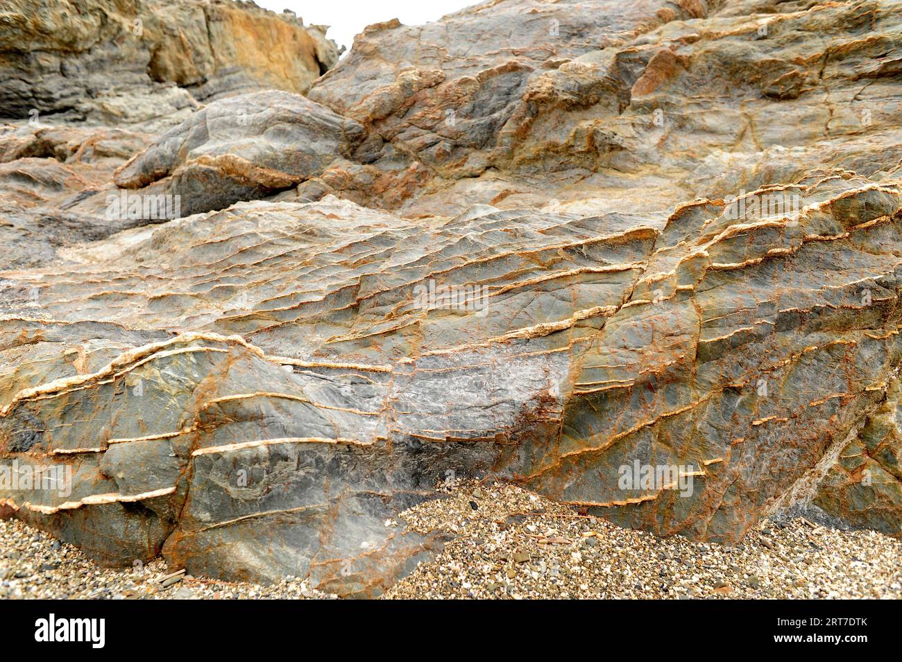 Quartz reefs break thorugh schist and microfaults. This photo was taken ...