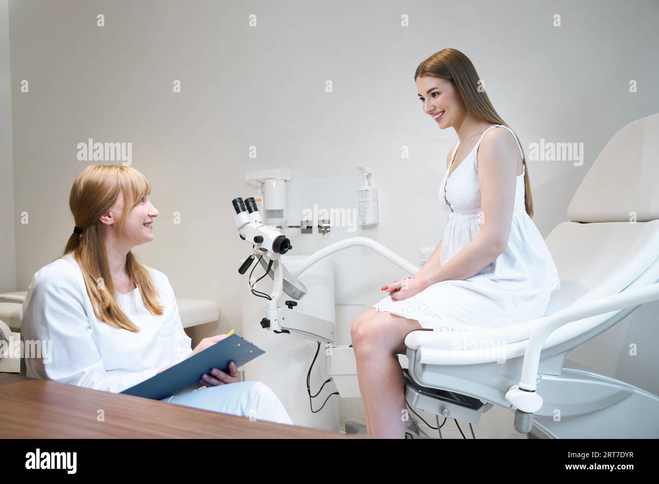 Young woman at a gynecologists appointment at a medical center Stock ...