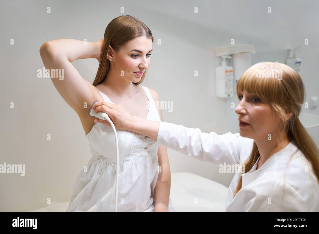 Beautiful young woman on procedure of ultrasound of lymph nodes Stock ...