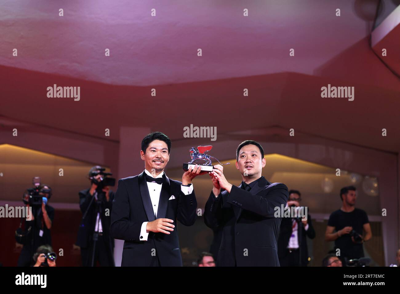 VENICE, ITALY - Sep 09: Hitoshi Omika and Ryûsuke Hamaguchi pose with ...