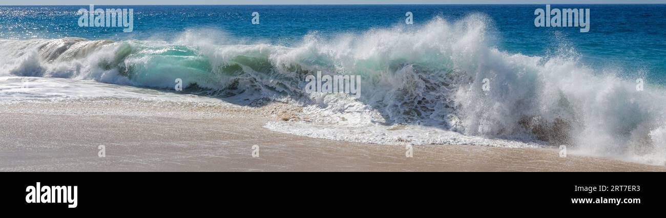 Blue wave on the beach. Dramatic natural background Stock Photo - Alamy