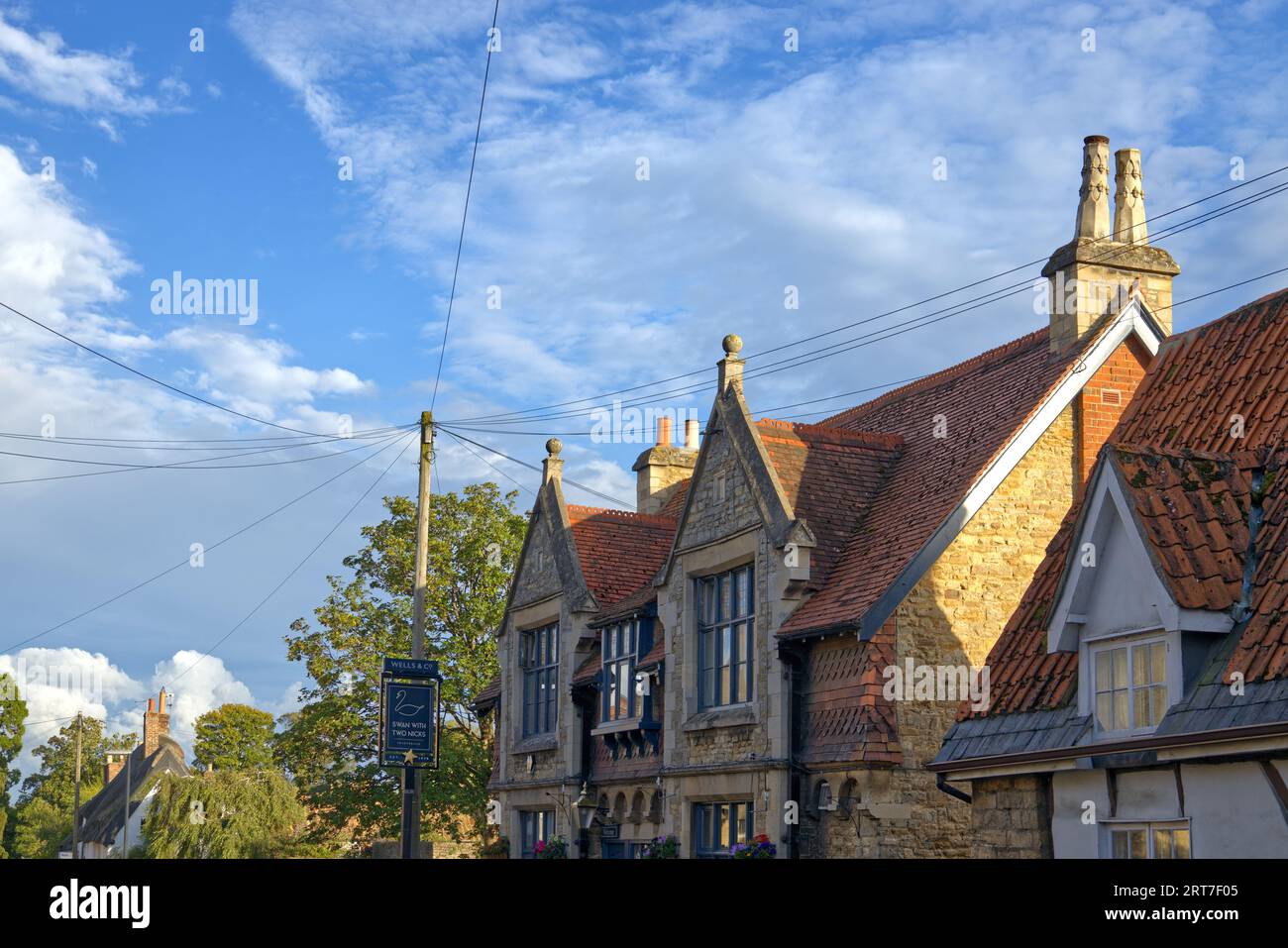 Pretty stone built Wells & Co pub in the high street of the ...