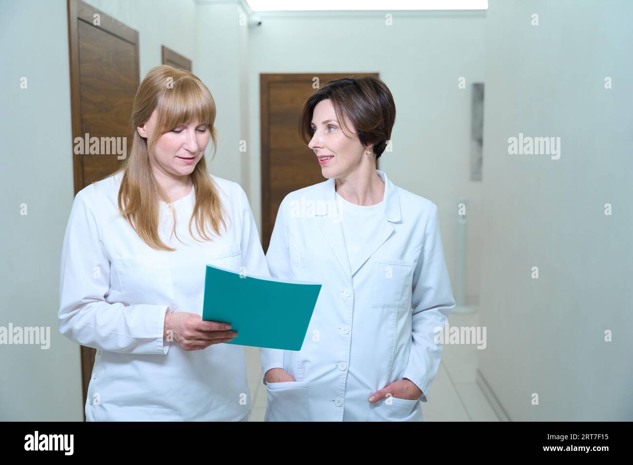 Lady doctor works patient documents hi-res stock photography and images ...