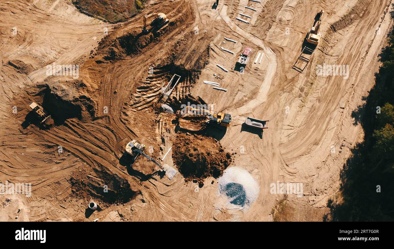 Aerial view of a bustling construction site, featuring a variety of ...