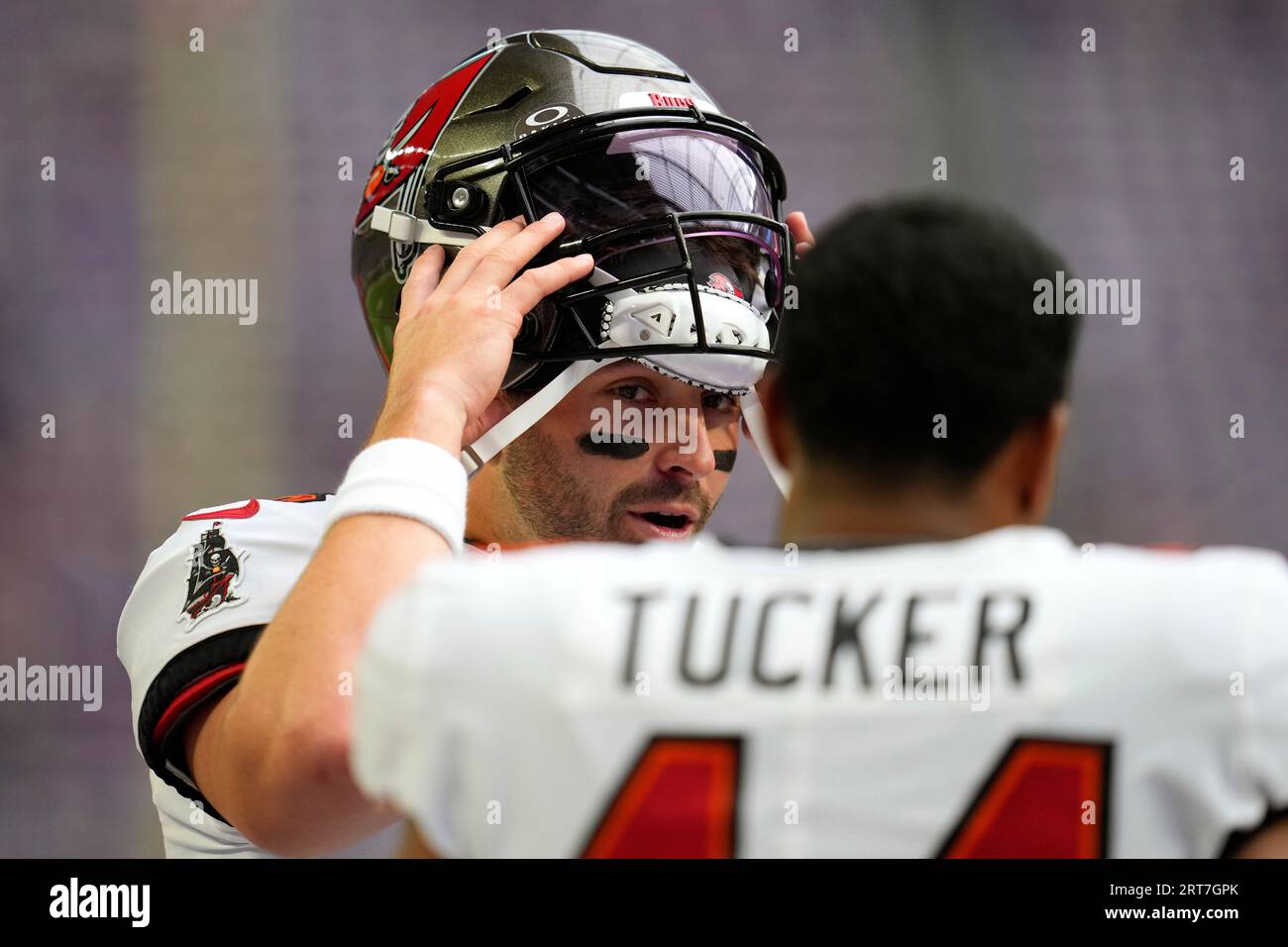 Tampa Bay Buccaneers quarterback Baker Mayfield stands next to running ...