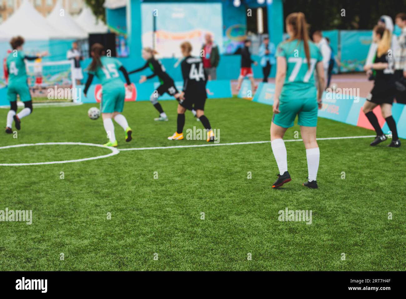 Female football street match outdoor game on an artificial astroturf ...