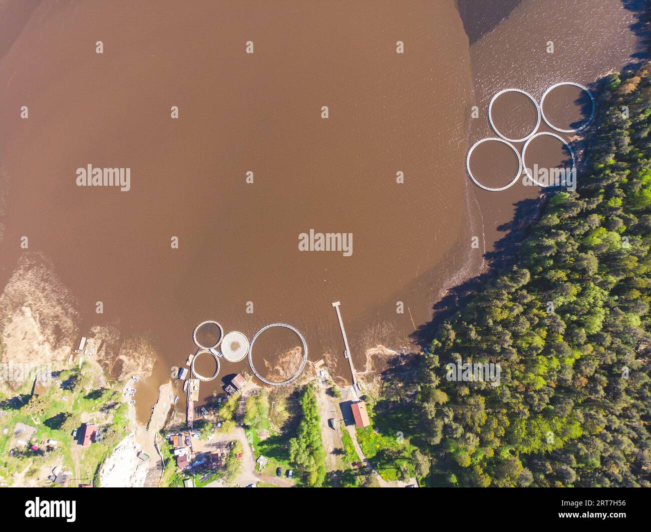 Aerial drone view of circle sea fish farm cages and round fishing nets ...