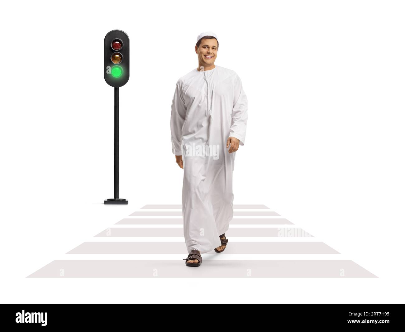 Full length portrait of a young muslim man in a traditional thobe ...