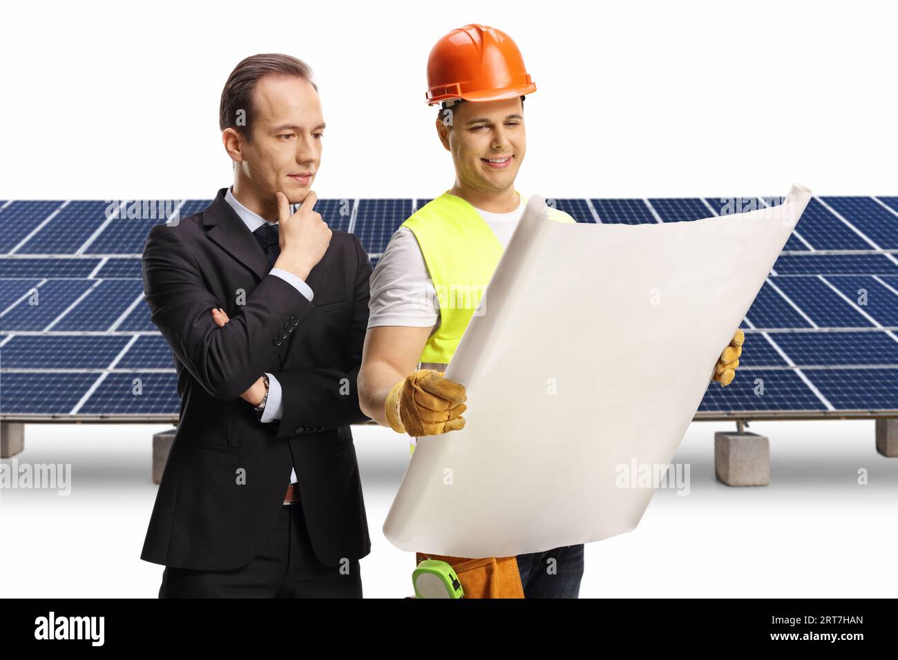 Businessman and an engineer looking at a blueprint at a solar farm ...