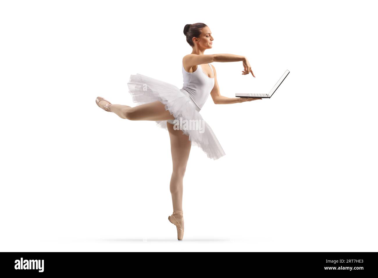 Full length shot of a ballerina dancing and using a laptop computer ...
