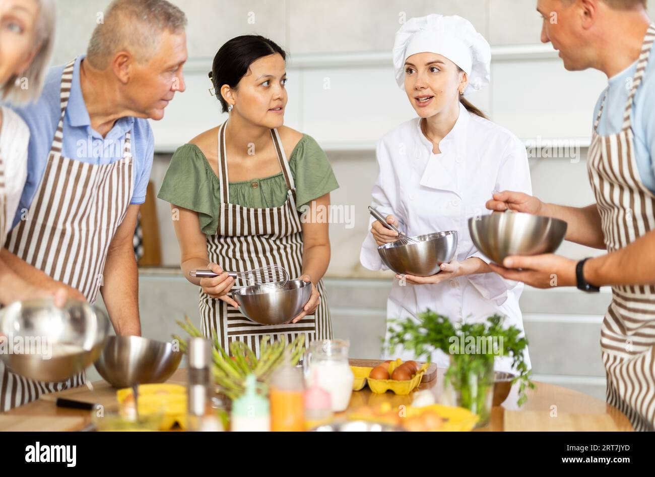 Elderly man teaches young hi-res stock photography and images - Alamy