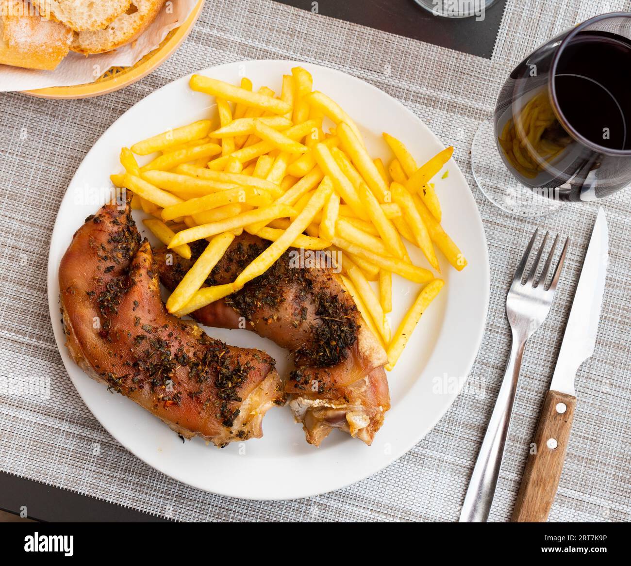 Just cooked pig's trotter on table Stock Photo - Alamy