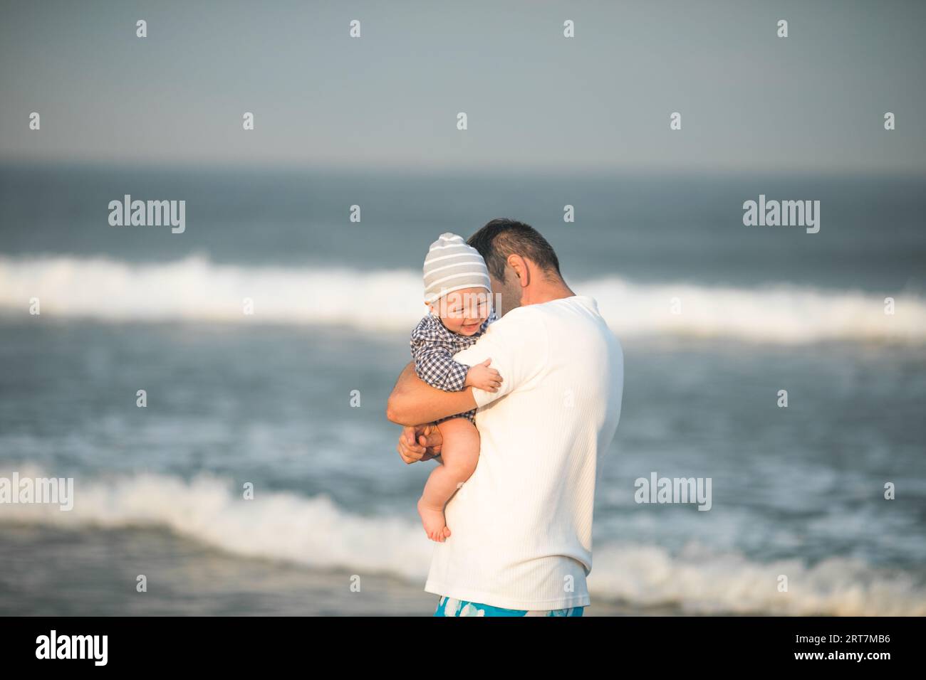 Happy Fathers day. Father and baby play on the beach. Dad and him Child ...