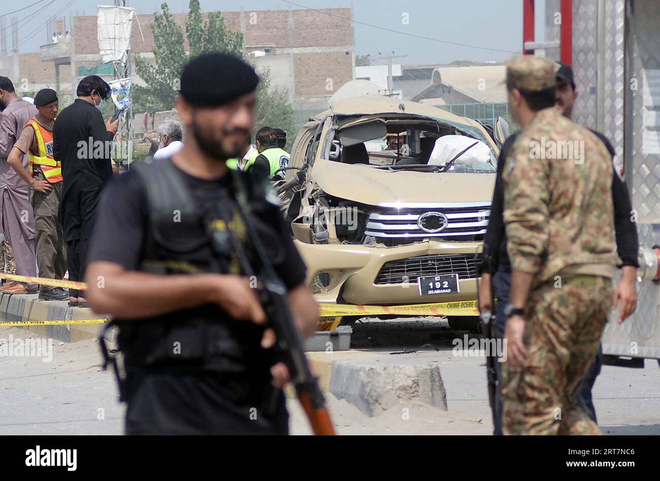 Security and rescue officials gather at the site after bomb attack that ...
