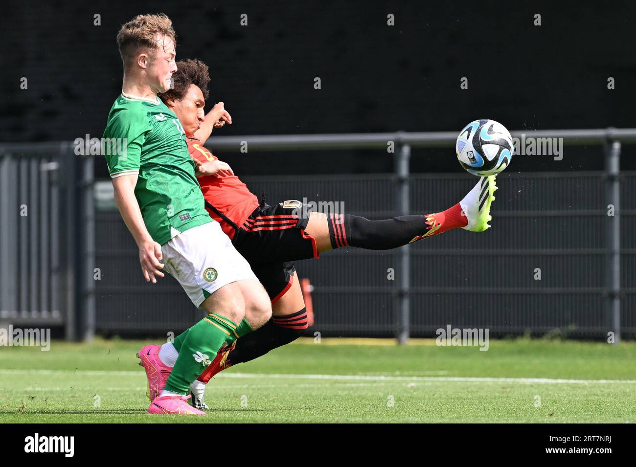 Kaylem Harnett (14) of Ireland pictured fighting for the ball with Zaïd ...