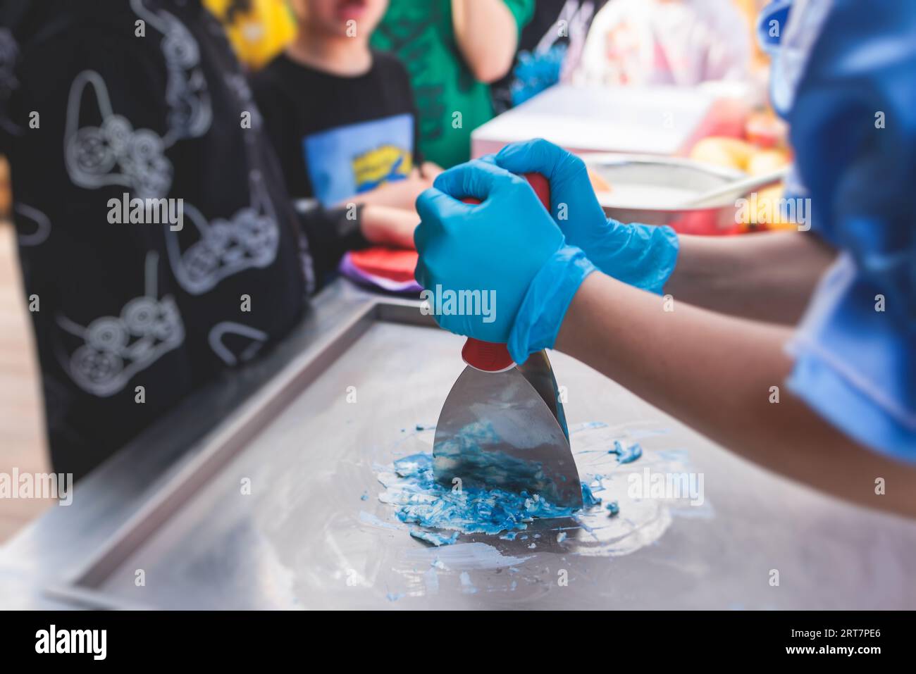 Rolled thai ice cream preparation, process of cooking coloured fried ...
