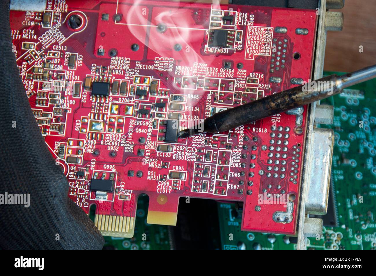 Motherboard repair parts soldering male close-up Stock Photo - Alamy
