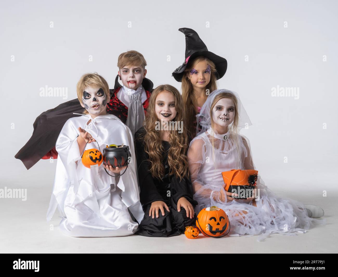 Group of children in fancy Halloween costume dress on white background ...