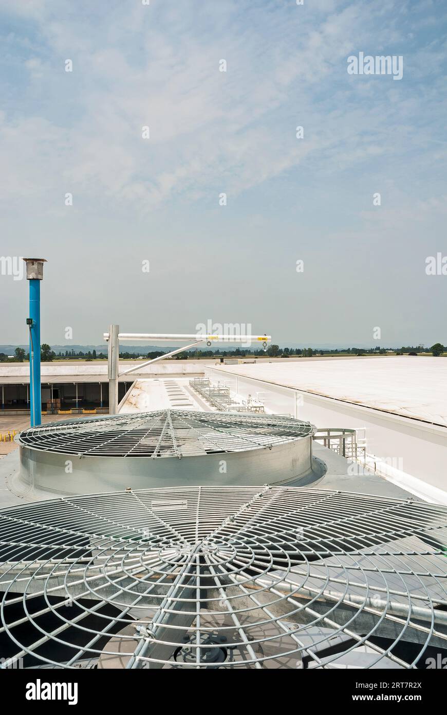 Commercial refrigeration condenser top cooling fans on roof of a cold ...