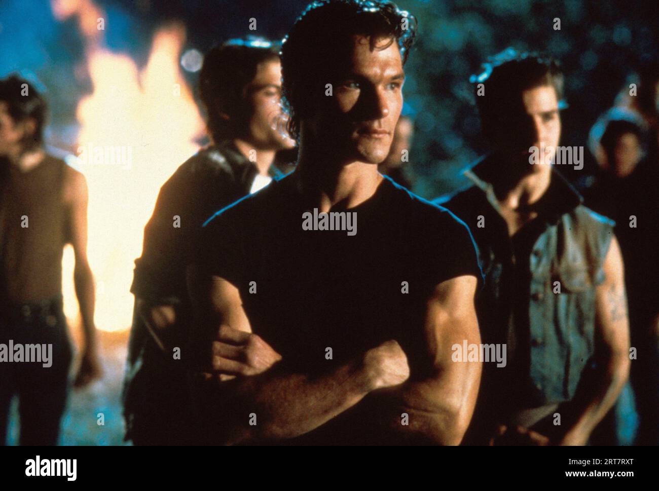 Patrick Swayze, Tom Cruise, "The Outsiders" (1983). Photo credit: Warner Bros. (File Reference ...