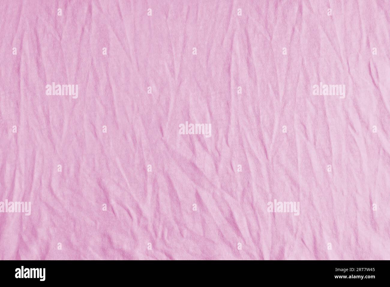 Wrinkled, crumpled pink fabric texture background. Wrinkled and creased ...