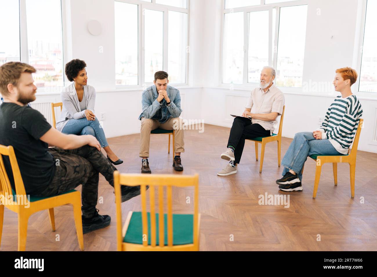 Wide remote shot of multicultural and different ages people meeting in ...
