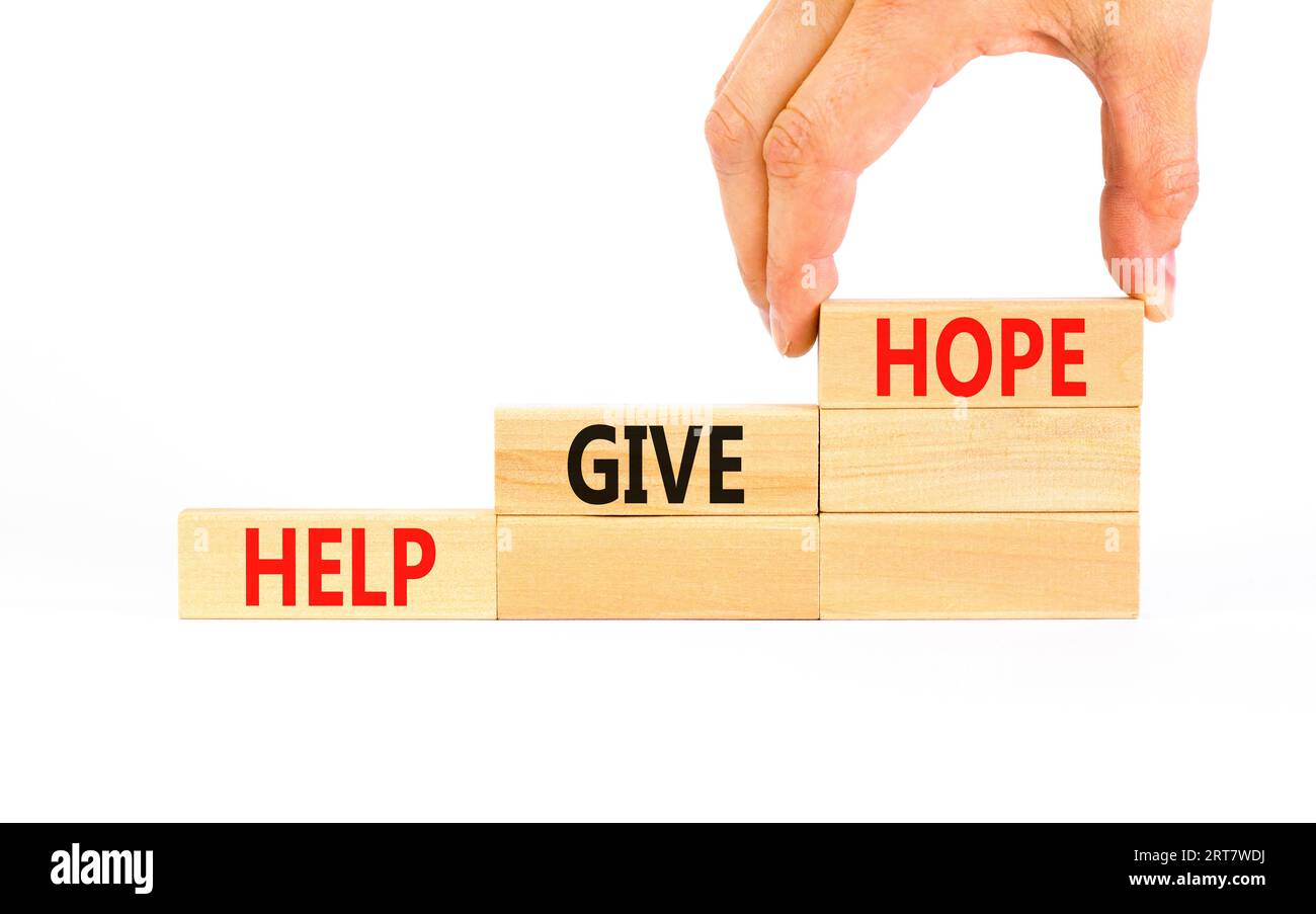 Help give hope symbol. Concept word Help give hope on beautiful wooden ...