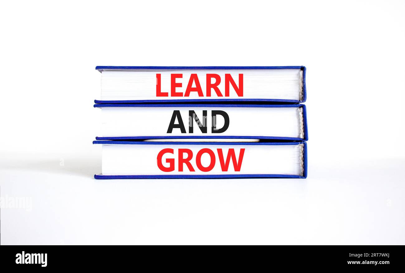 Learn and grow symbol. Concept word Learn And Grow on beautiful books ...
