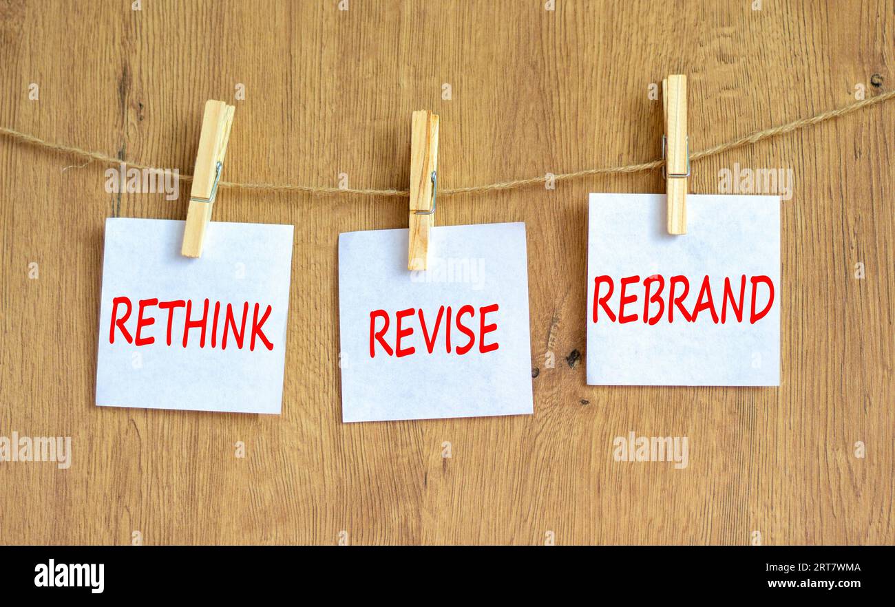 Rethink revise rebrand symbol. Concept word Rethink Revise Rebrand on white paper on clothespin ...