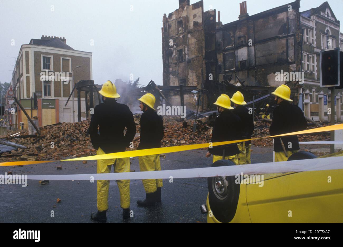 Brixton Riots 1980s UK. The day after firefighter making sure the ...