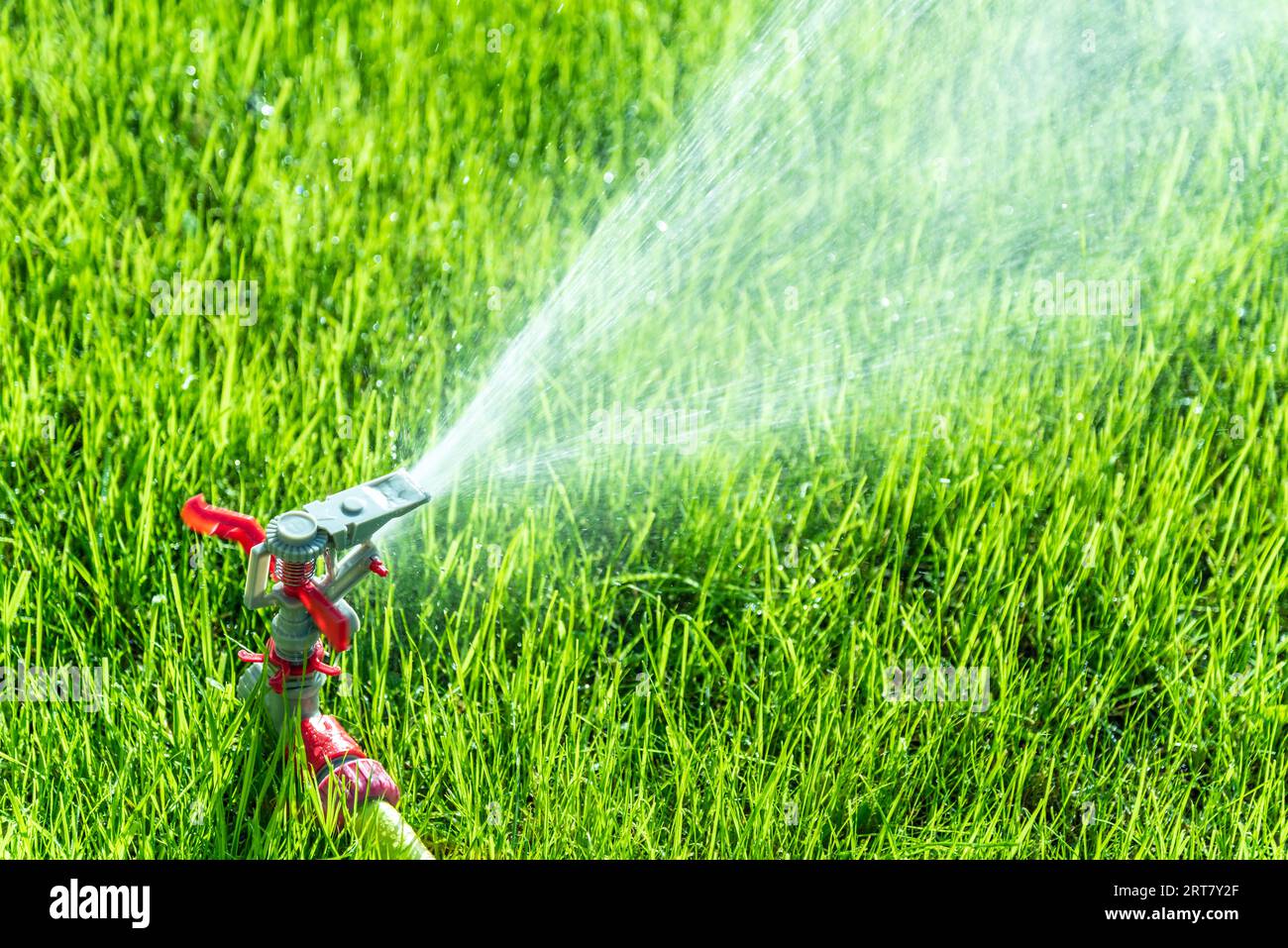 Sprinkler in action spraying hi-res stock photography and images - Alamy