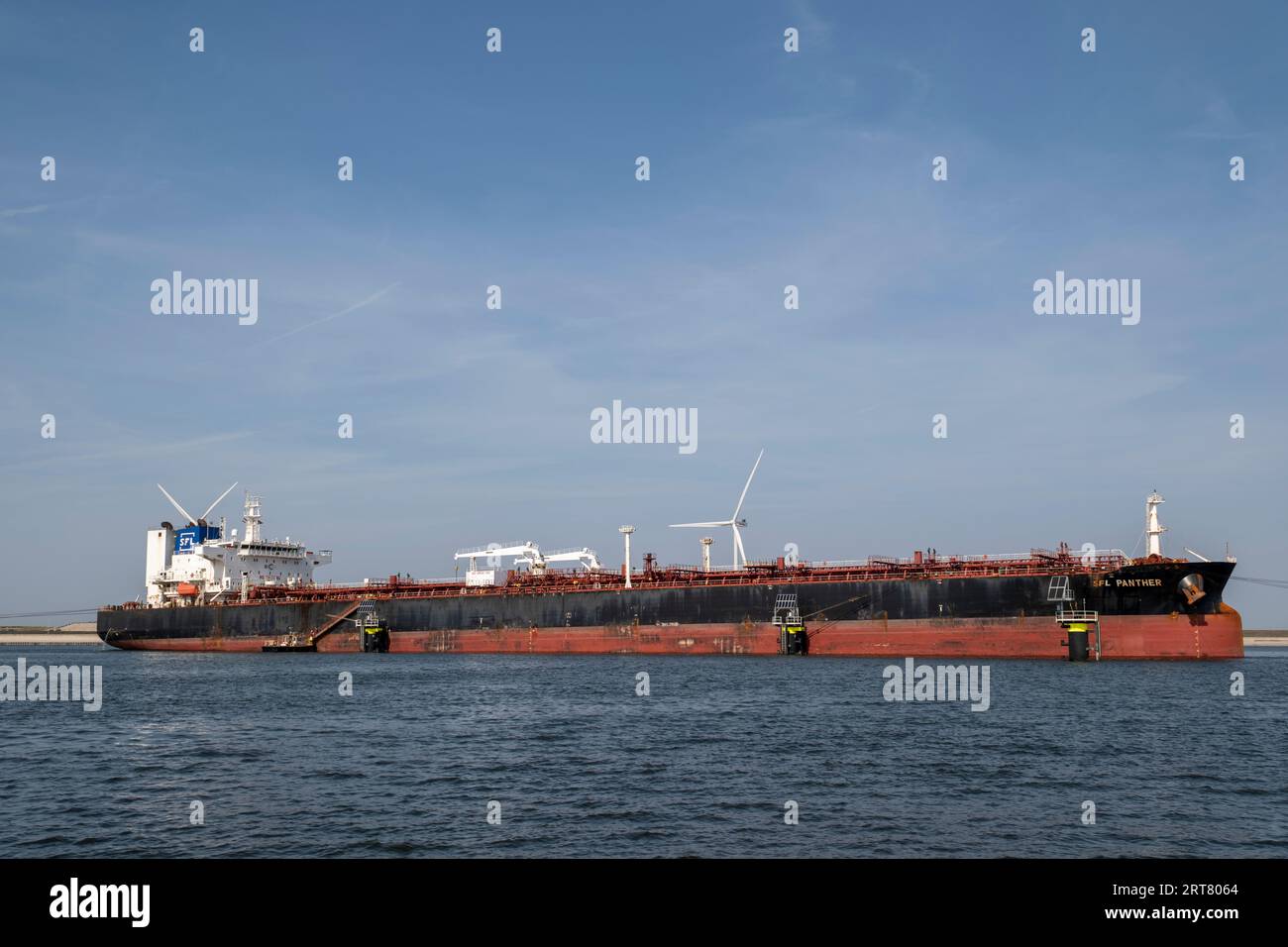 Large LNG tanker ship in a harbour on a clear summer day. Port of ...