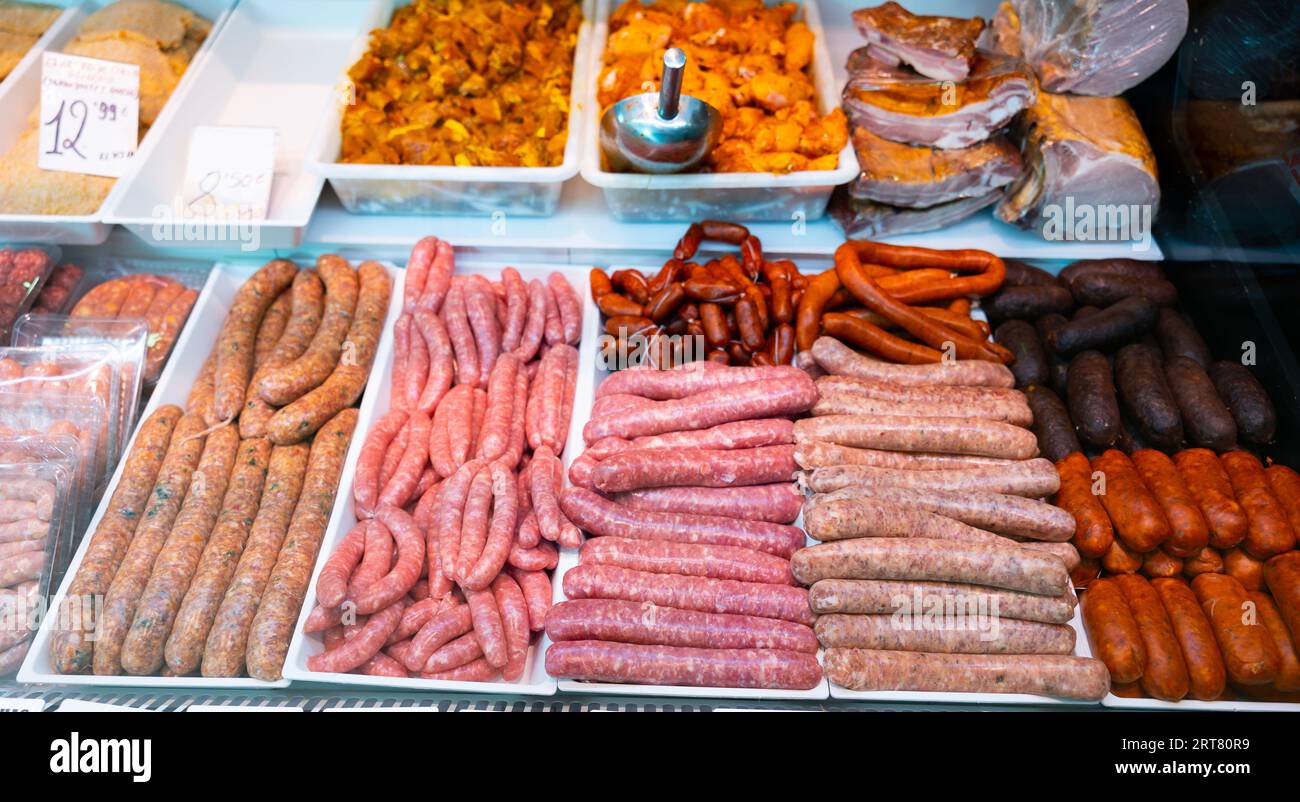 Variety of sausages in display case of butchery shop Stock Photo - Alamy