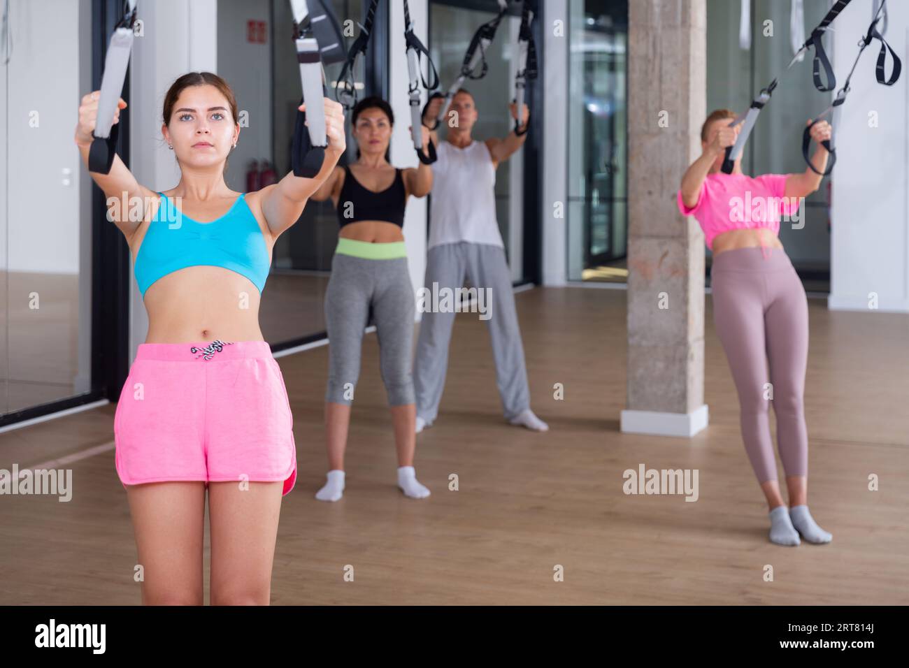 Woman training trx pilates hi-res stock photography and images - Alamy