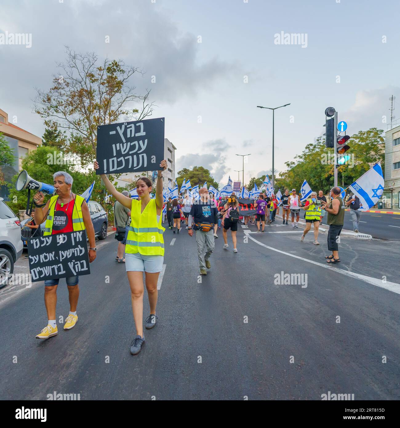 Haifa, Israel - September 09, 2023: People march with various signs and ...