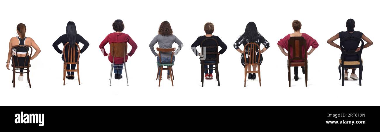 group of woman sitting on chair with arms akimbo on white background ...
