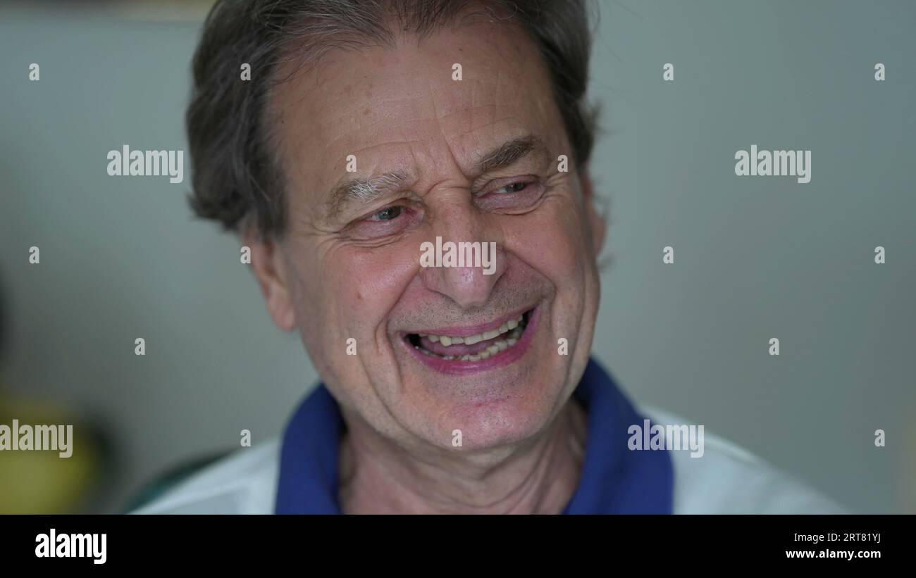 Happy senior man laughing and smiling, close-up face of retired elderly ...