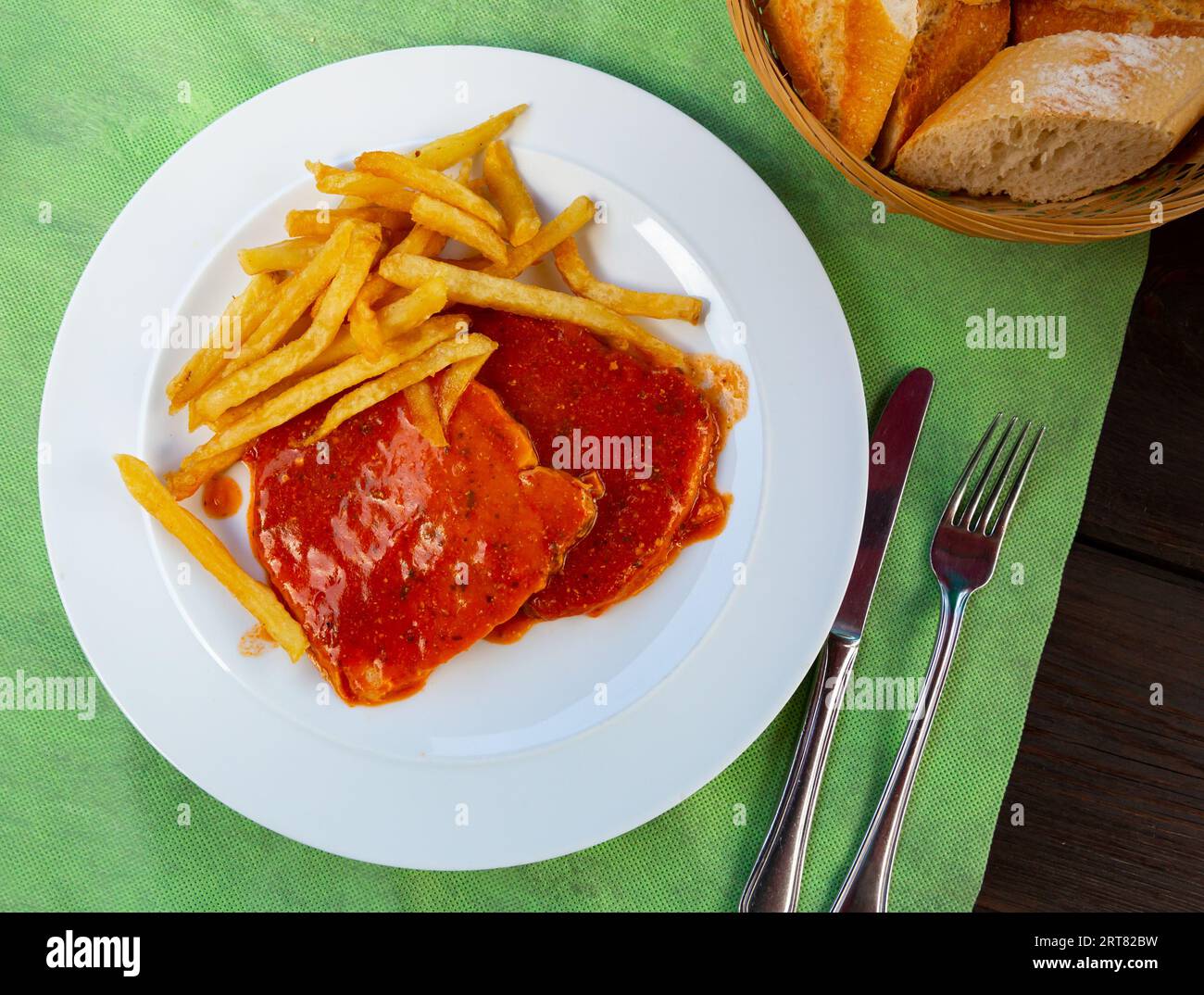 Baked loin with sauce and potatoes Stock Photo - Alamy