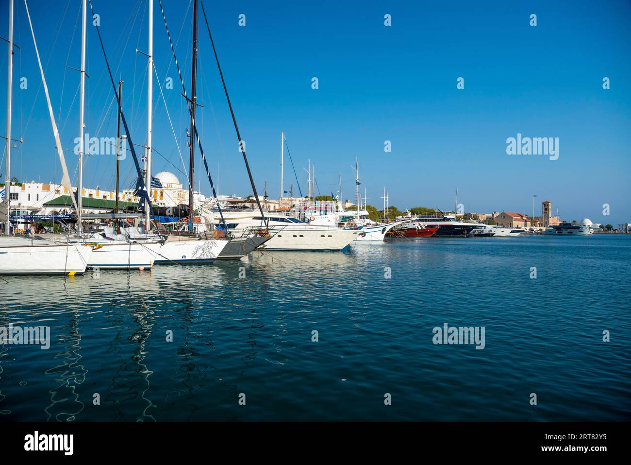 Yachts and boats, Rhodes harbour, Ekklisia Evangelismou church, Greece ...