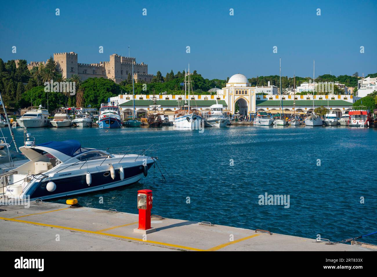 The New Market at Mandraki Harbour, Grand Master's Palace in the back ...