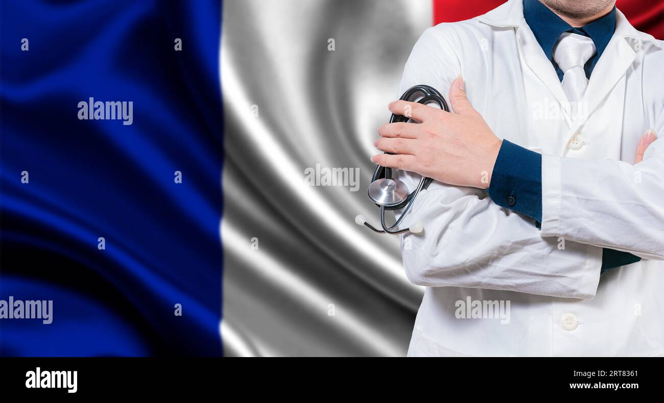 Doctor with stethoscope on French flag. Doctor with arms crossed on ...