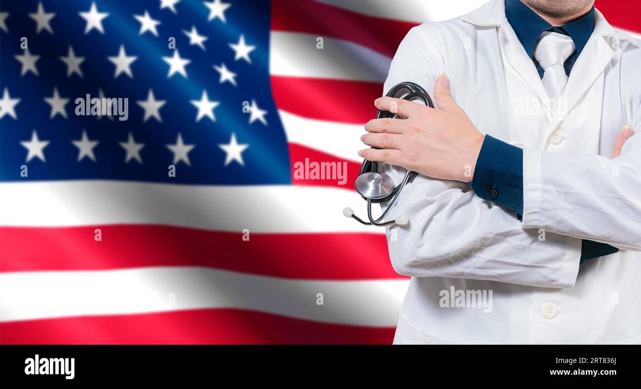 Doctor with stethoscope on American flag. Doctor with arms crossed on ...