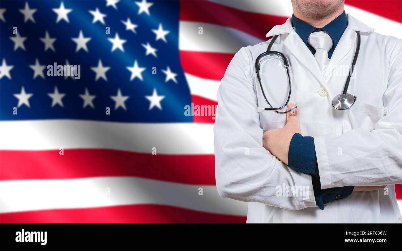 Doctor with stethoscope on USA flag. Doctor with arms crossed on USA ...