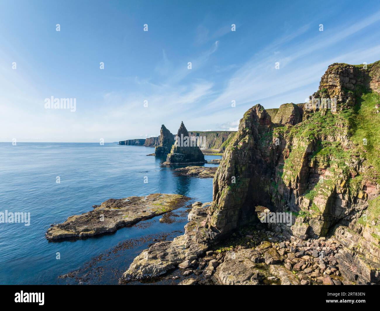 Aerial view of the rugged coastal landscape with the Duncansby Stacks ...