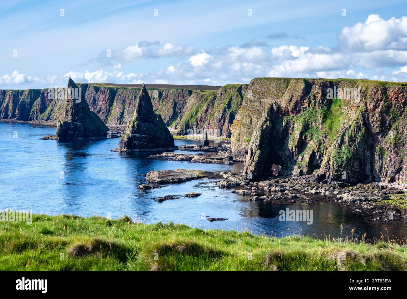 Rugged coastal landscape with the Duncansby Stacks on the coast of ...