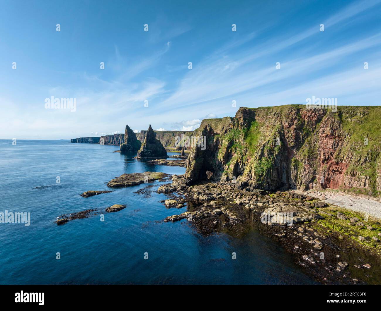Aerial view of the rugged coastal landscape with the Duncansby Stacks ...