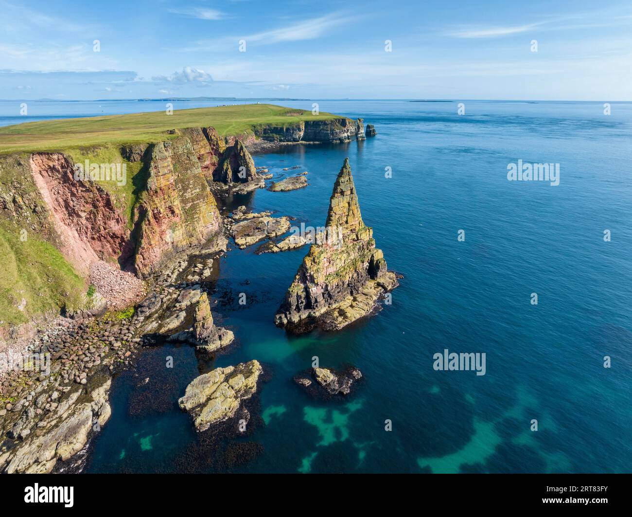 Aerial view of the rugged coastal landscape with the Duncansby Stacks ...